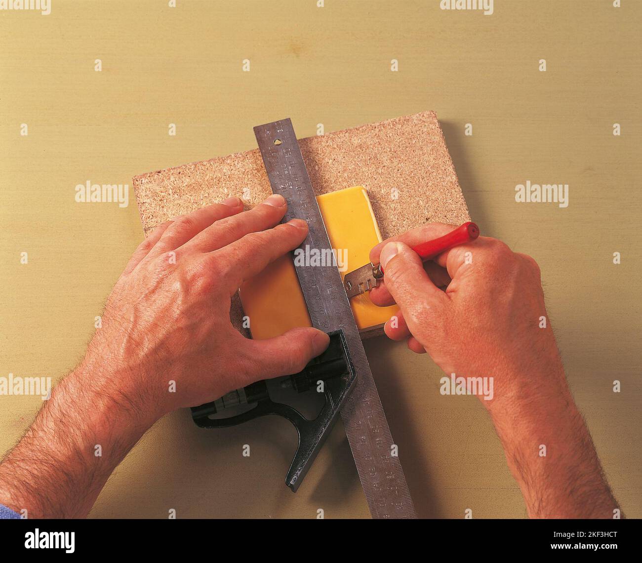 Cutting a piece of ceramics with glass cutter Stock Photo - Alamy