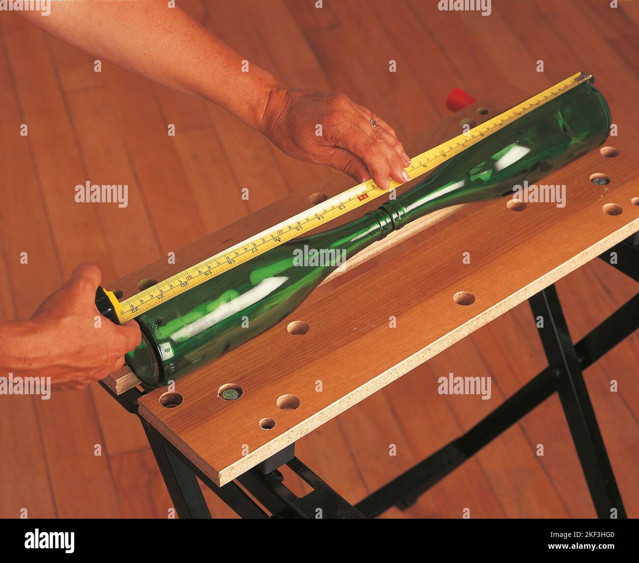 Measuring the combined length of two bottles Stock Photo - Alamy