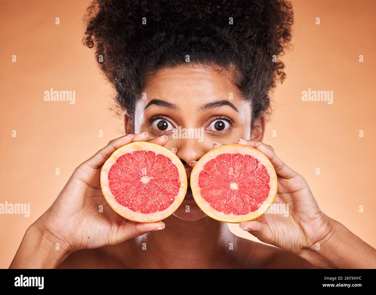 Black woman, skincare and grapefruit cosmetic for skin with vitamin c treatment, facial citrus ...