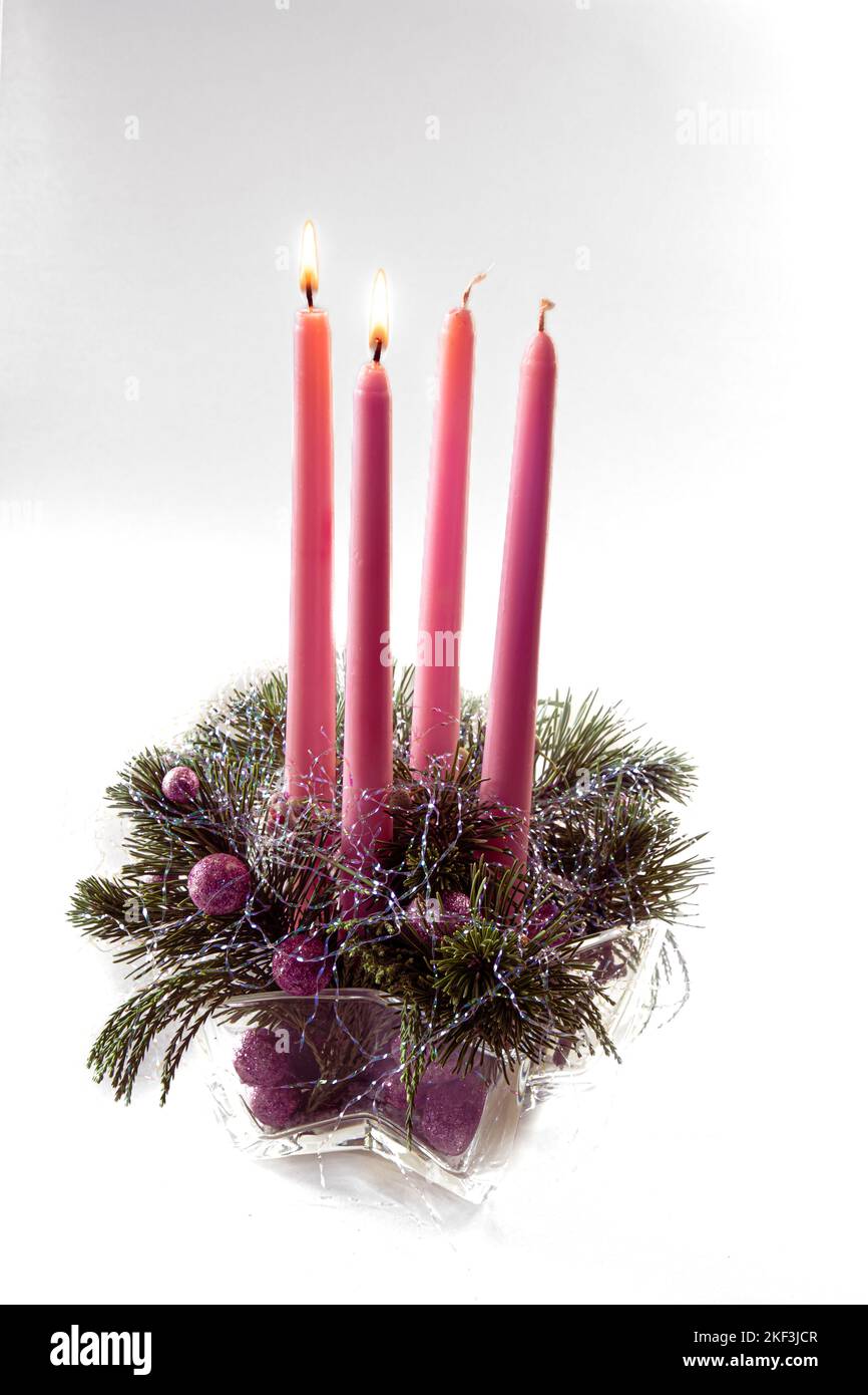 4 pink advent candles with 2 burning in religious cristian traditional ...