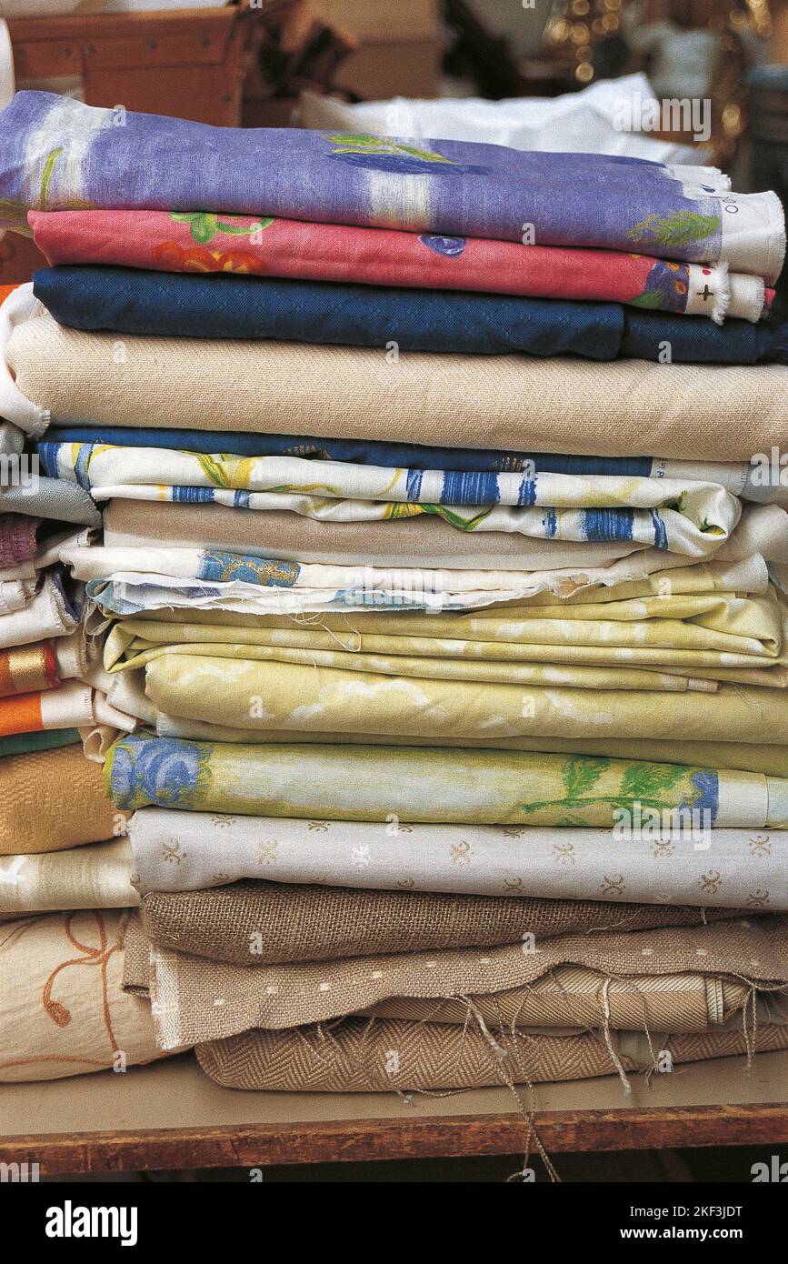 A pile of folded fabrics Stock Photo - Alamy