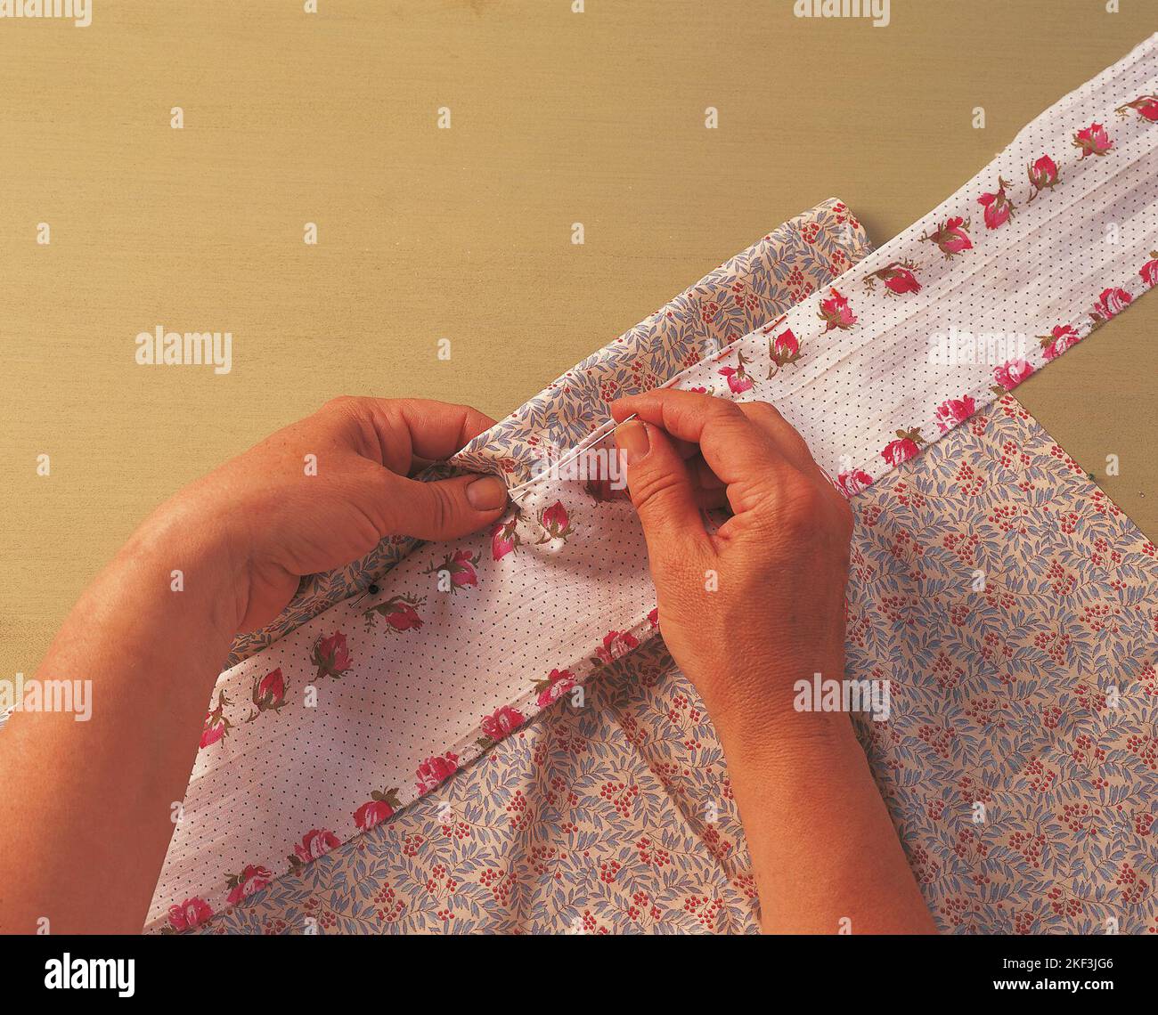 Joining two pieces of fabric before stitching Stock Photo - Alamy