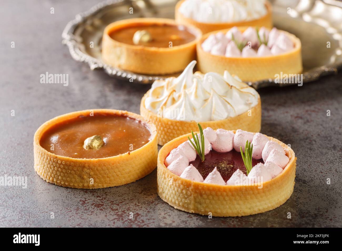 Delicious gourmet sweets tartlets for the holiday with meringue and ...