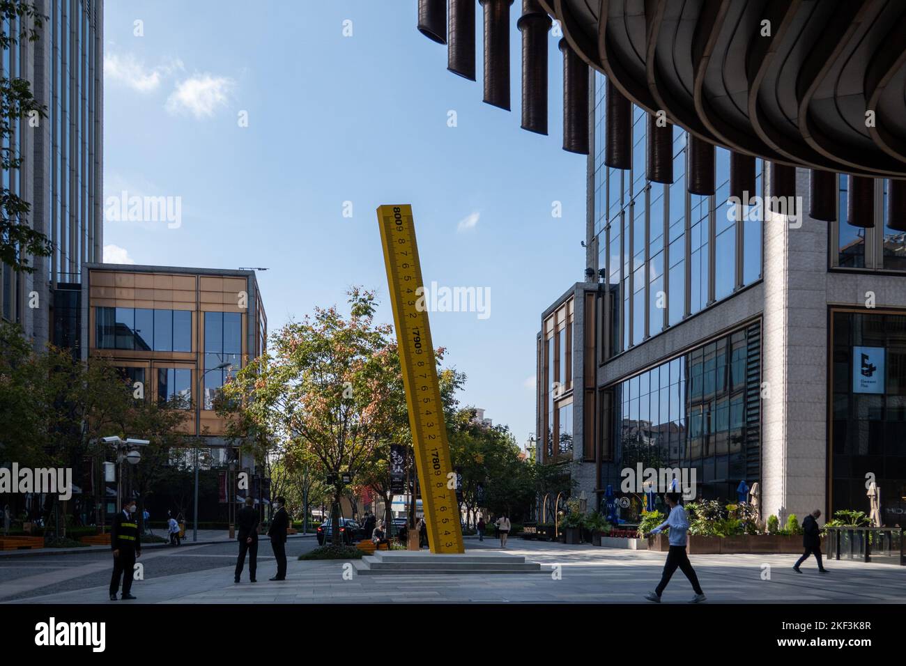 A yellow ruler about three meters high appeared on the square of the ...