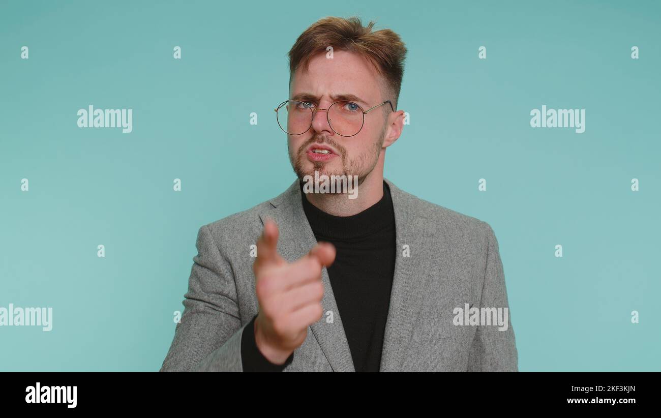 Quarrel. Displeased business man gesturing hands with irritation and ...