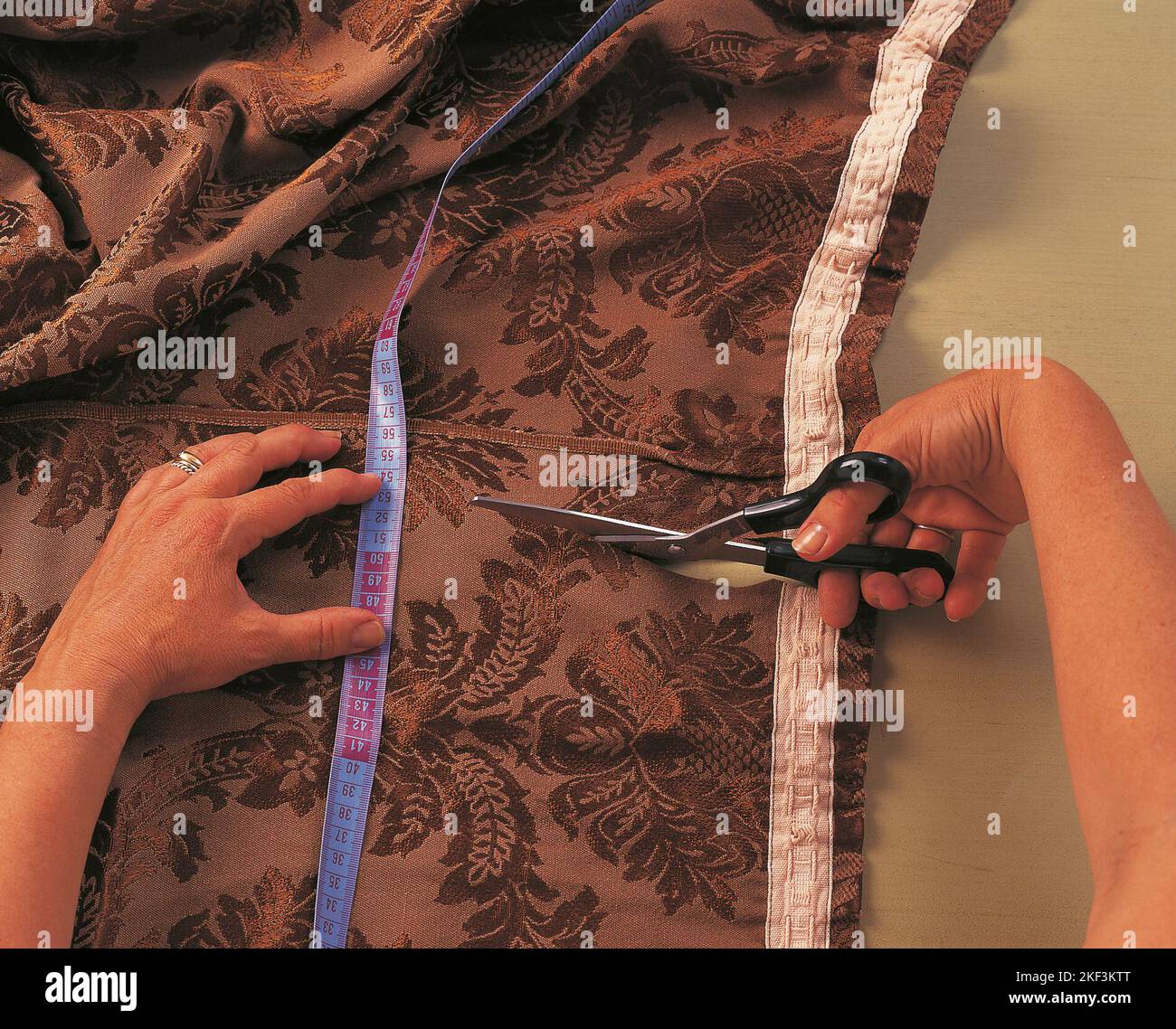 Cutting out the covering fabric Stock Photo - Alamy