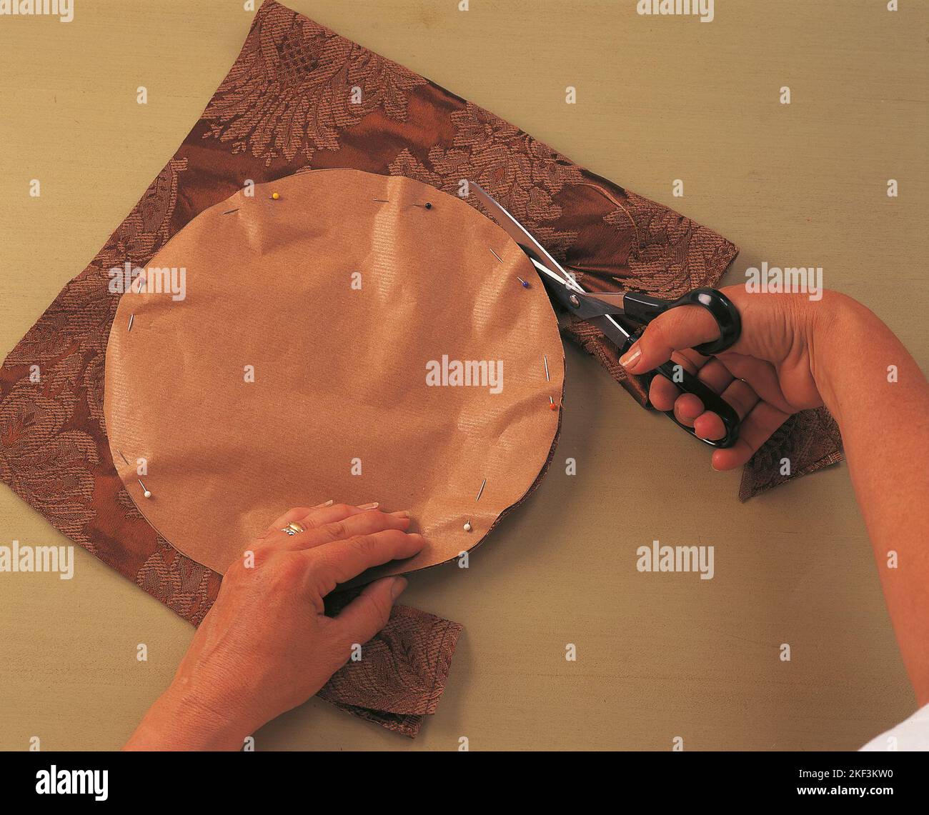 Cutting out a fabric circle Stock Photo - Alamy