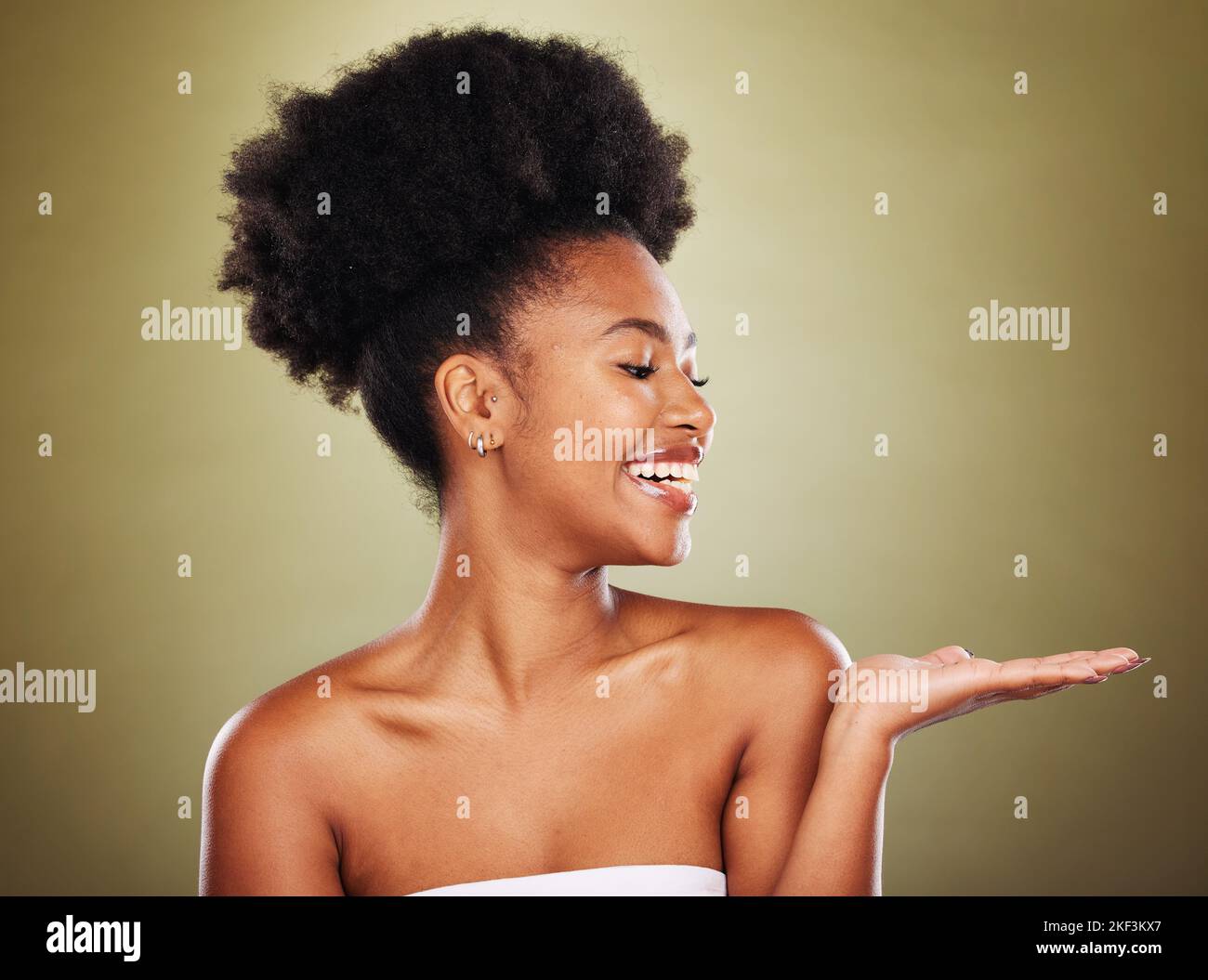 Black woman, skincare and hand open gesture in studio while happy ...