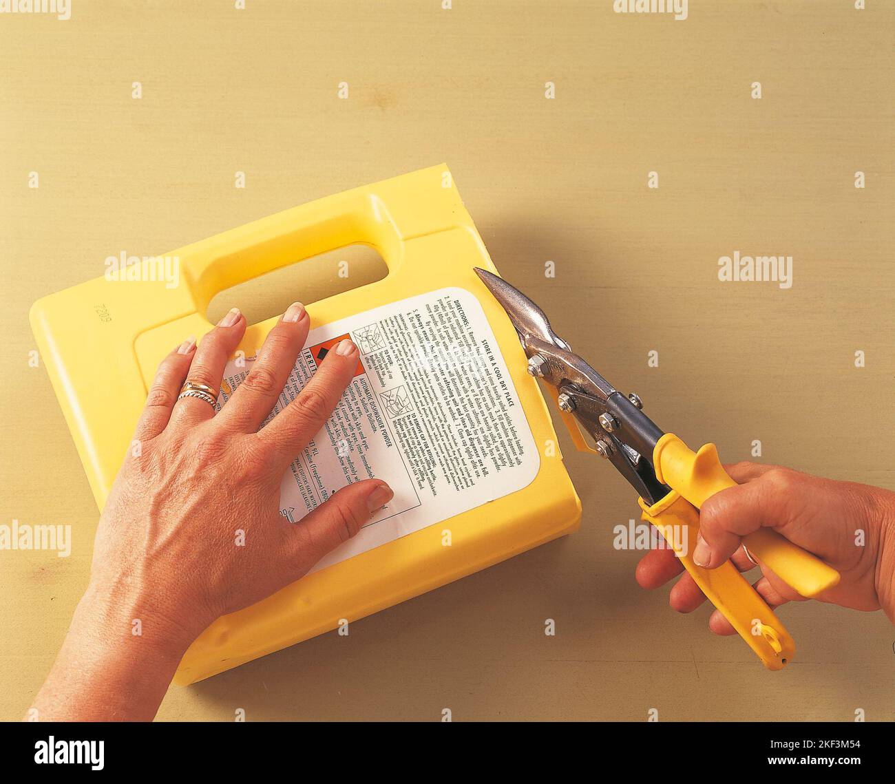 Cutting tin hi-res stock photography and images - Alamy