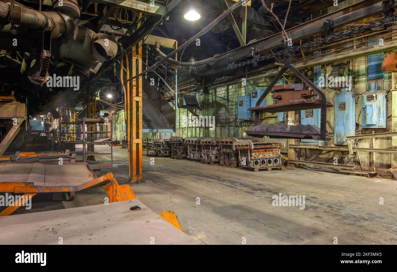 Overhead conveyor in an old car parts factory Stock Photo - Alamy