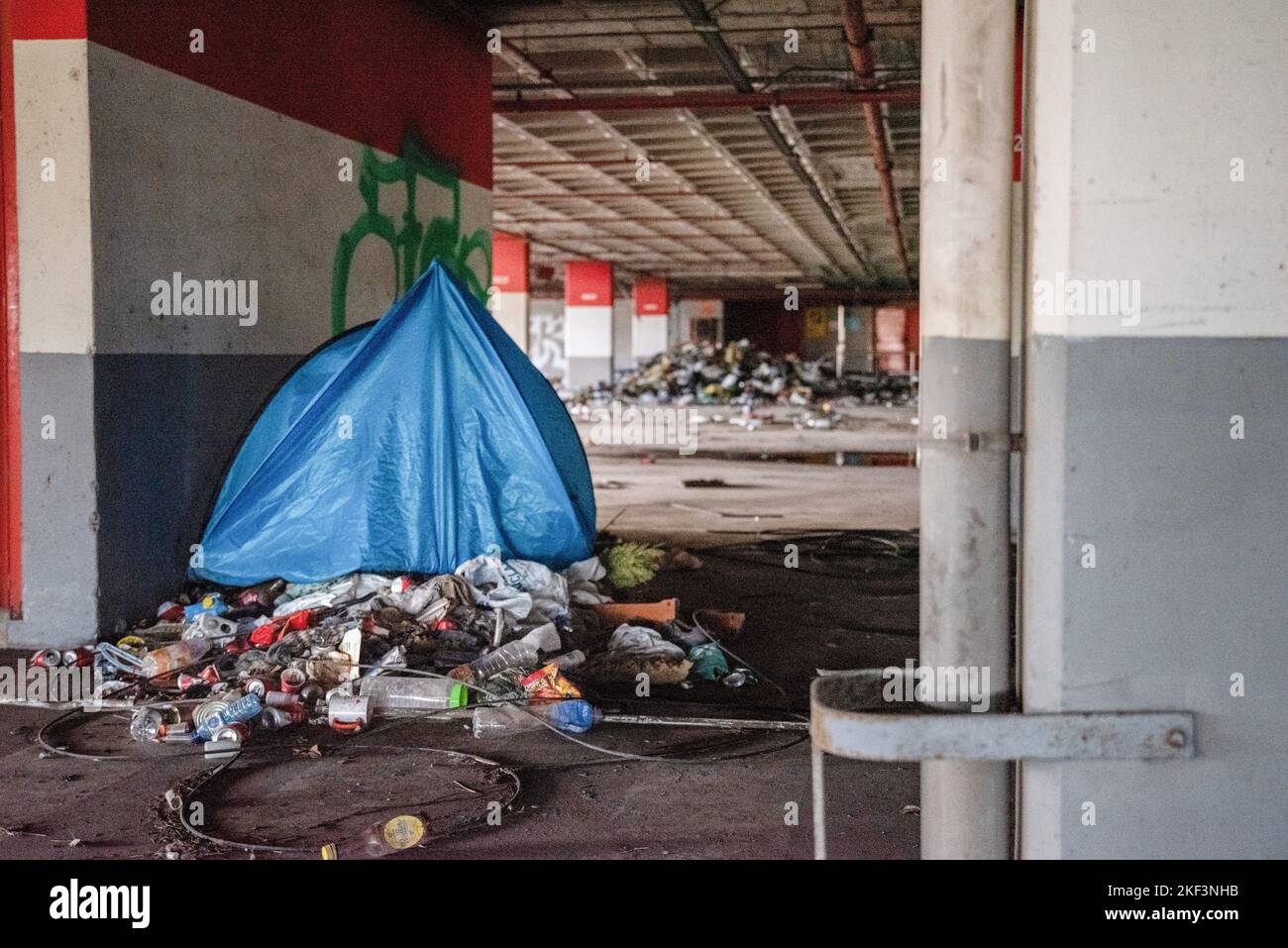 A tent, a shelter for a homeless person is seen near a pile of garbage ...