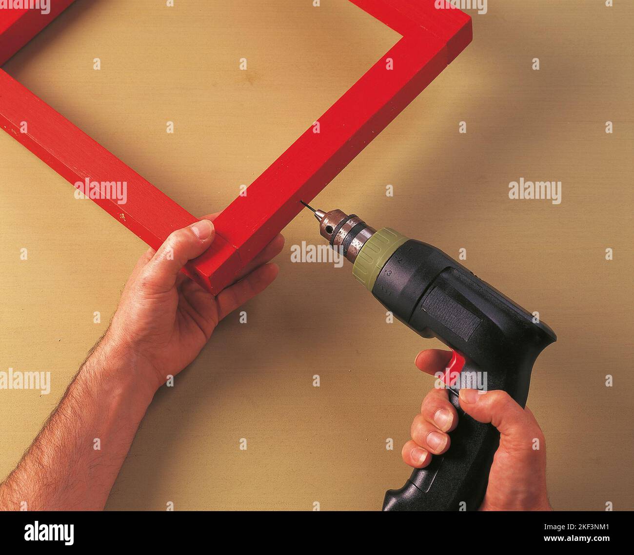 Drilling through the frame Stock Photo - Alamy