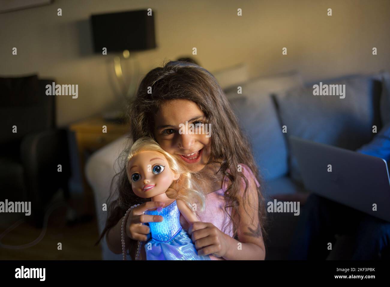 Holding her doll hi-res stock photography and images - Alamy