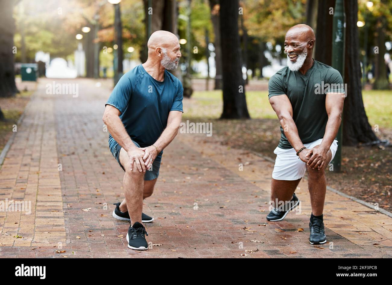 Elderly men, training and stretching for morning workout in the park or ...