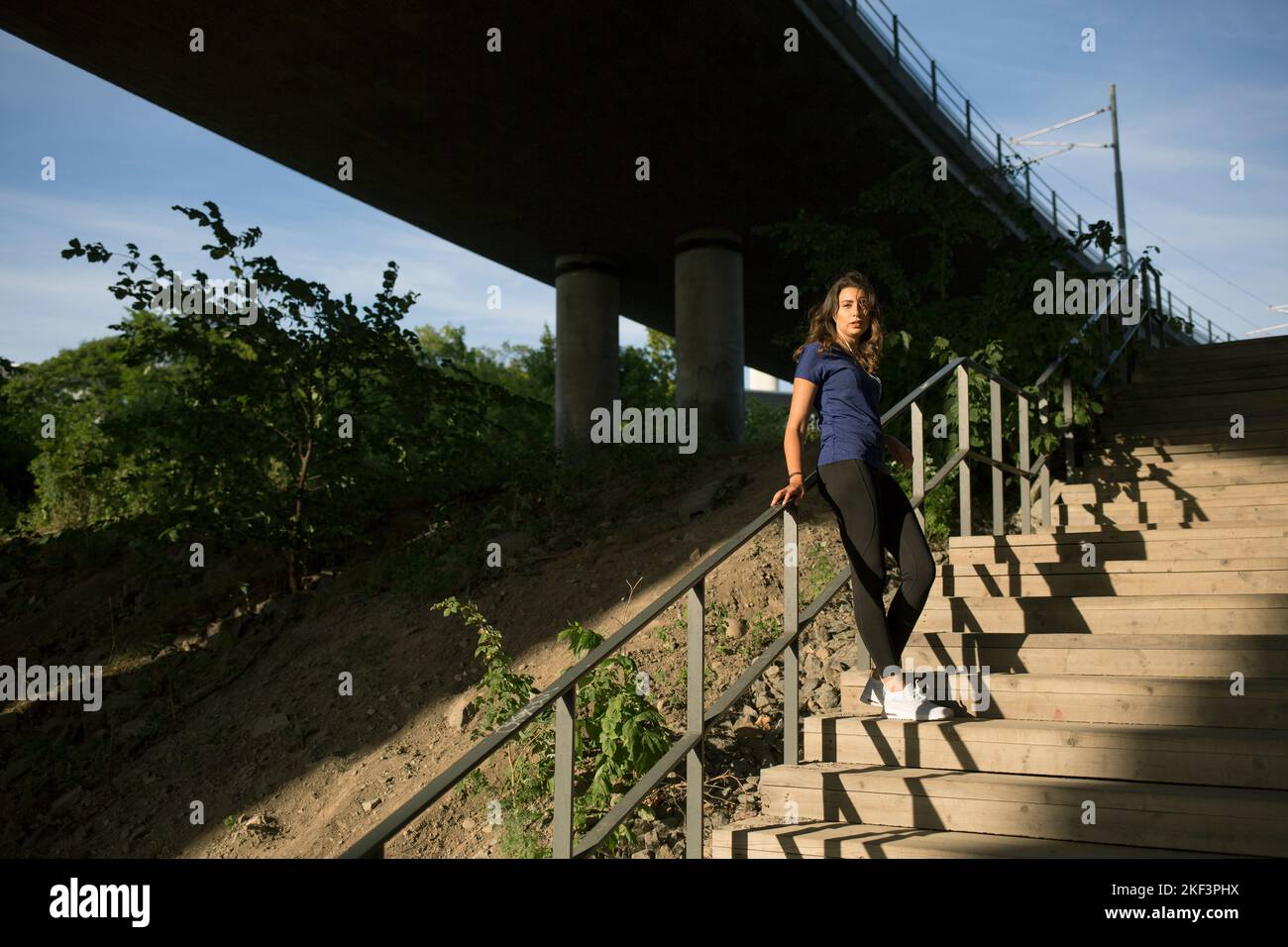 Woman leaning on railing looking at hi-res stock photography and images ...