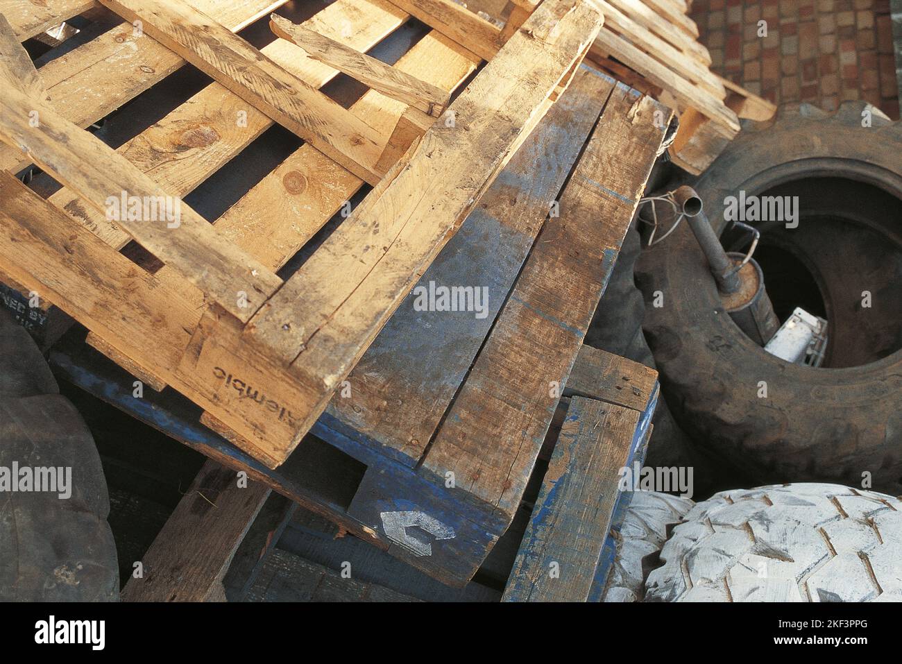 Old wooden pallets and car tires Stock Photo - Alamy