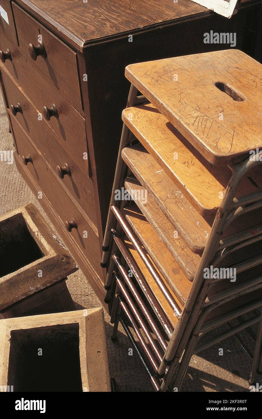 A stack of wooden stools and a chest of drawer Stock Photo - Alamy
