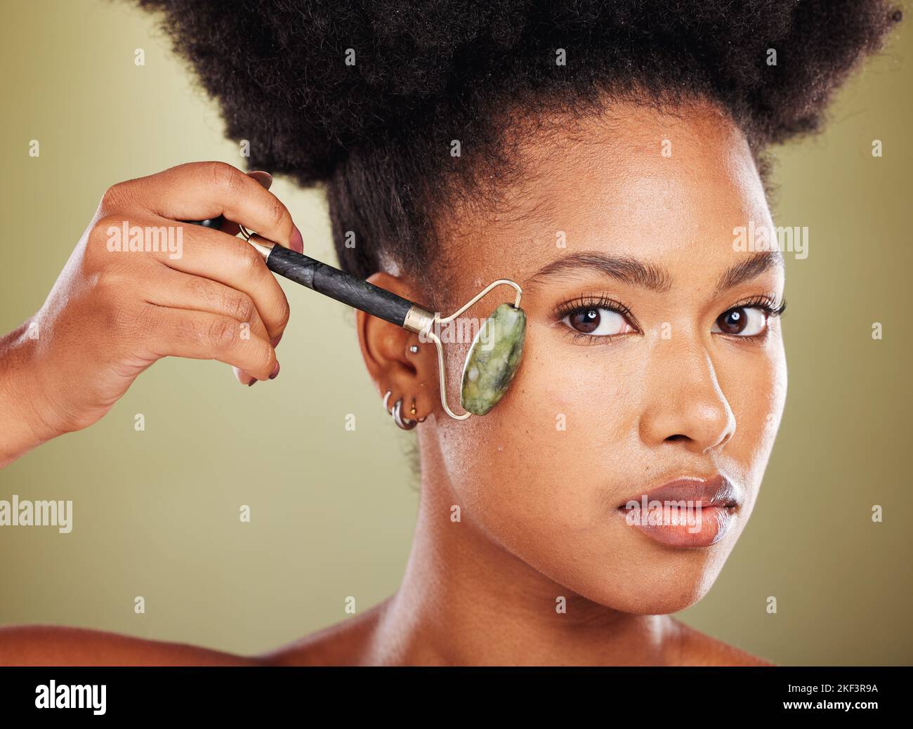 Roller, black woman facial beauty or model for skin healthcare ...