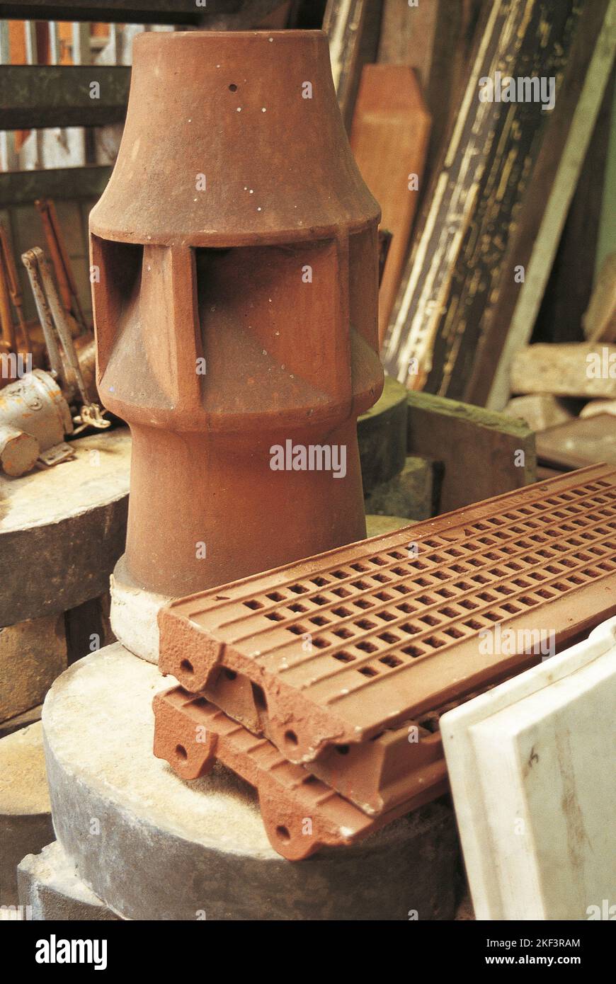 An old chimney pot and other scrap materials Stock Photo - Alamy