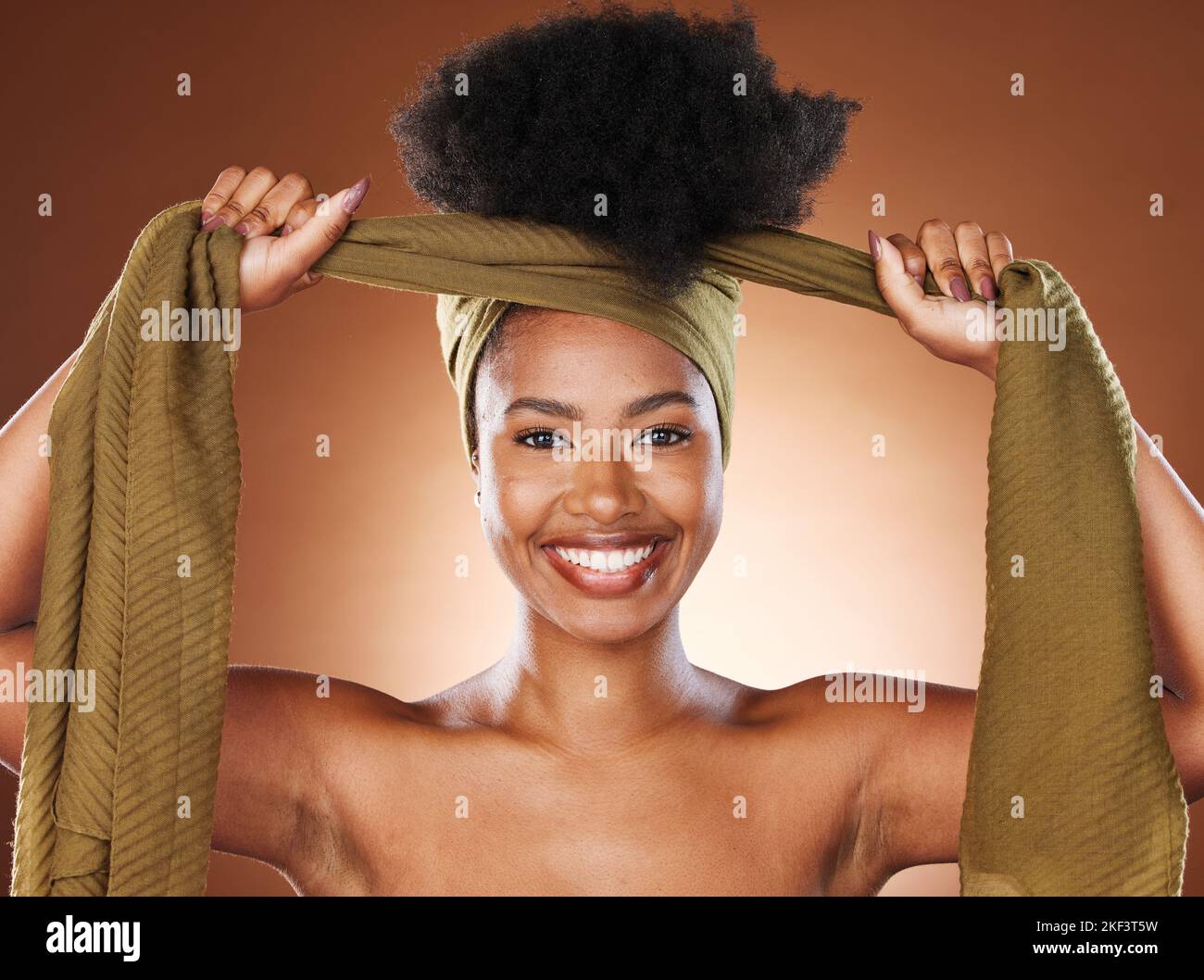 Face, beauty and black woman with hair scarf in studio on brown ...