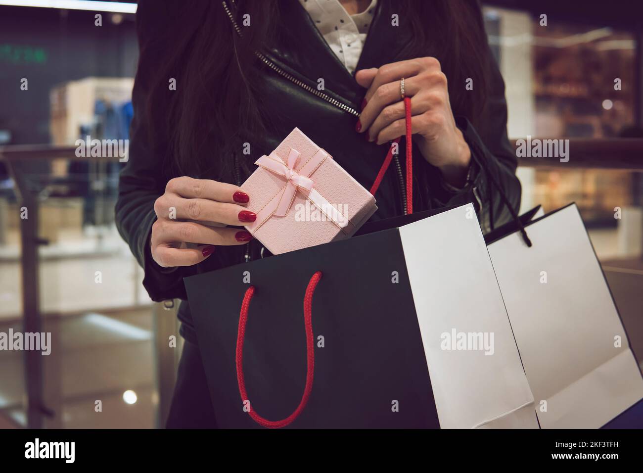 Crop shot of a fashionable woman with shopping bags after successful ...