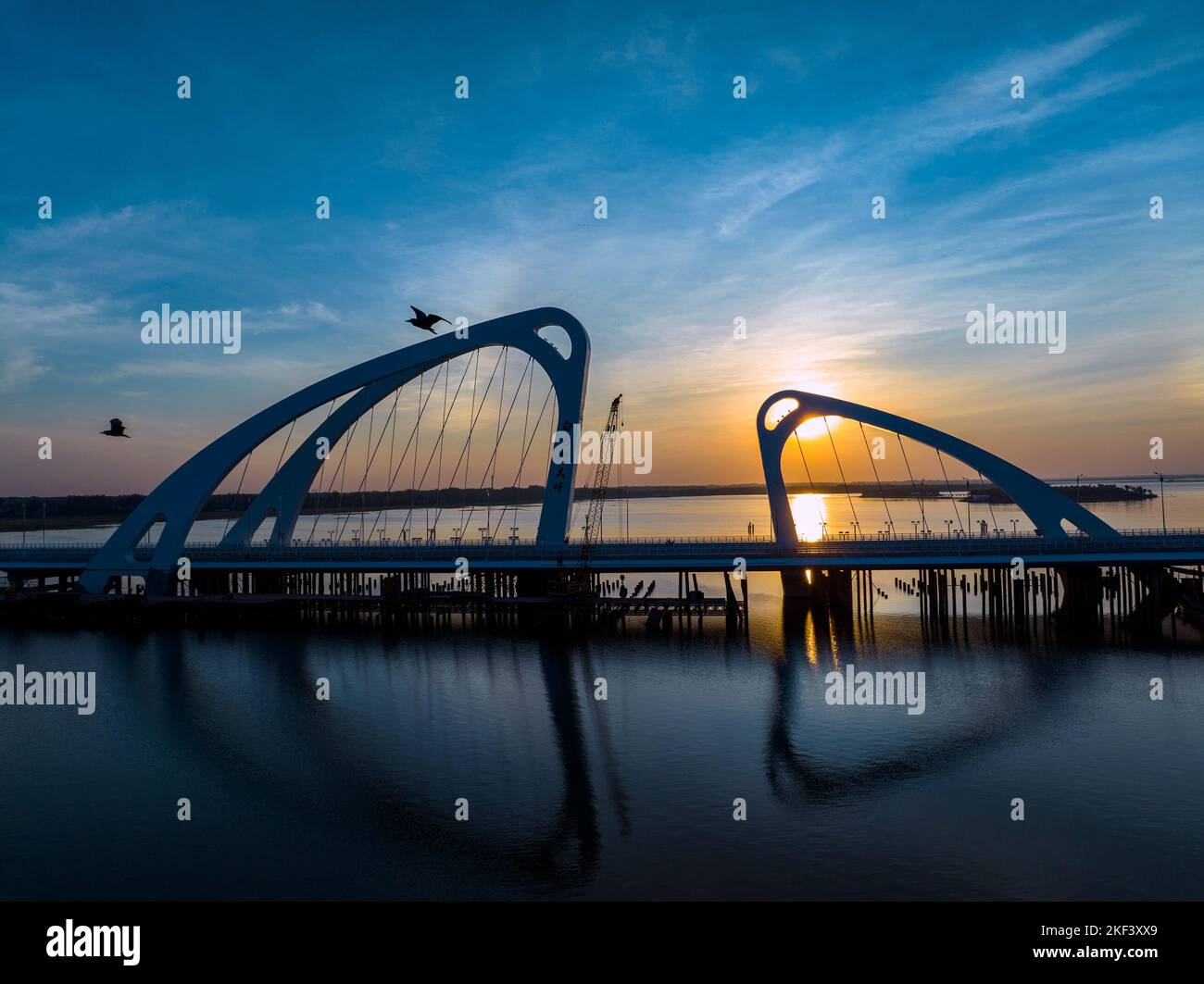 Aerial photo show the sunrise views of the Baima Lake Bridge in Huai'an ...
