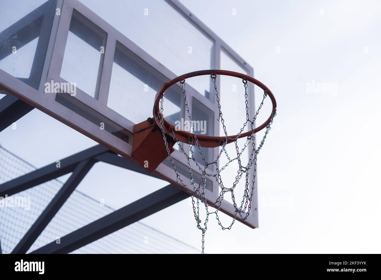 outdoor basketball in front of a blue sky. The basketball hoop or ring ...