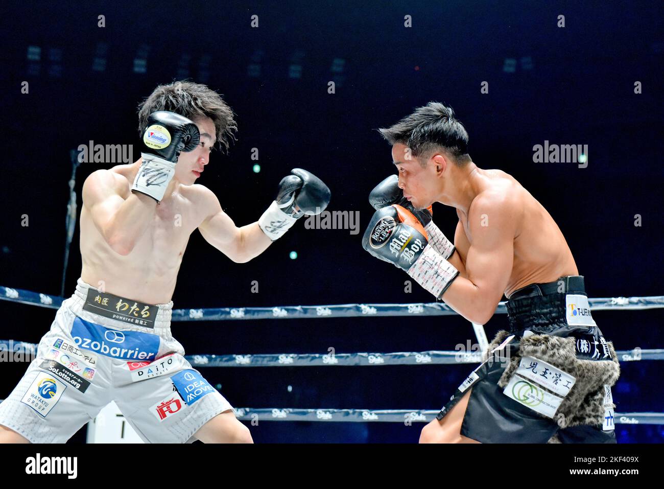 WBC light flyweight champion Kenshiro Teraji (white trunks) and WBA super champion Hiroto ...