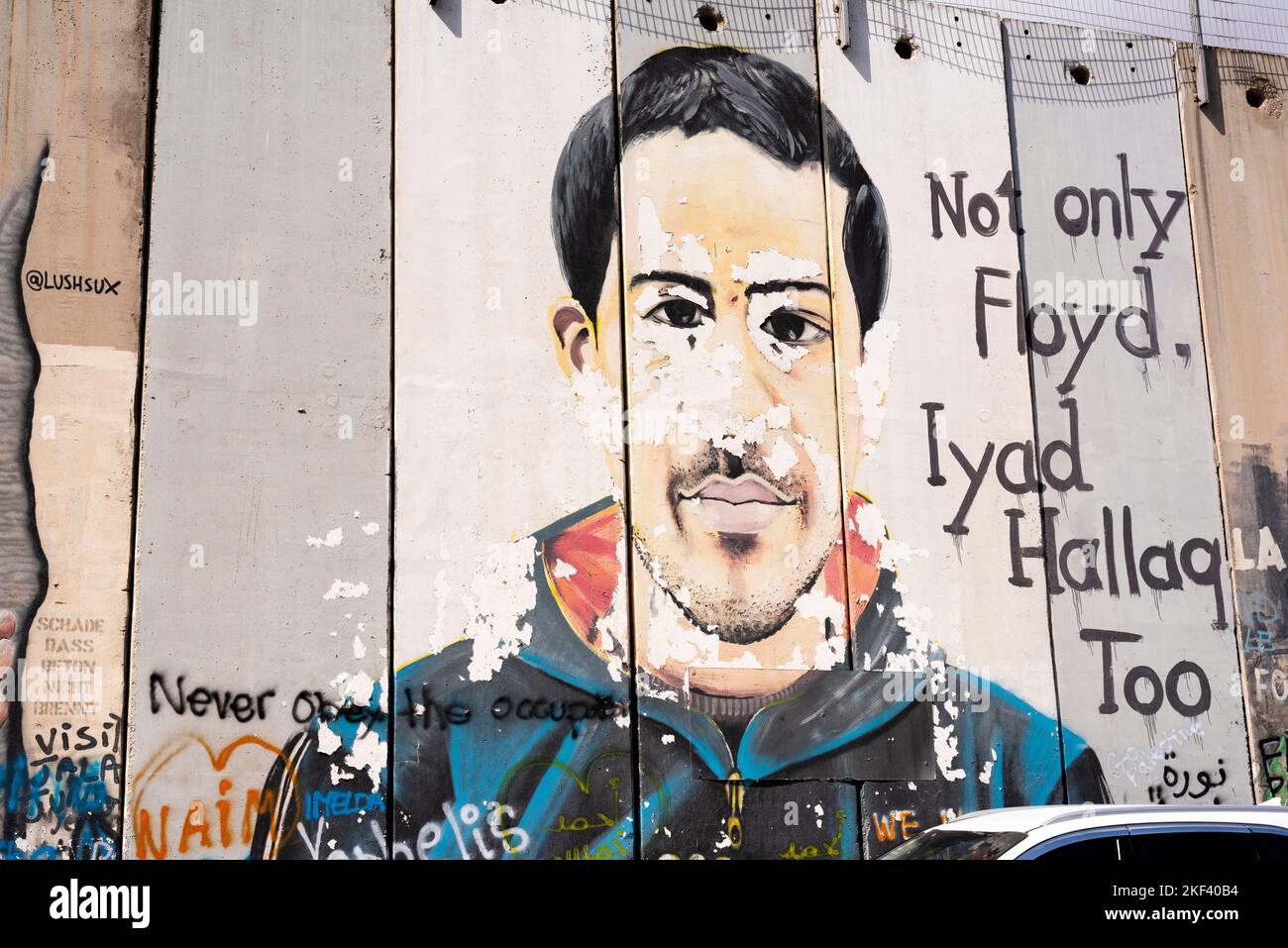 Graffiti on the Separation barrier - A mural of Iyad Hallaq Stock Photo ...