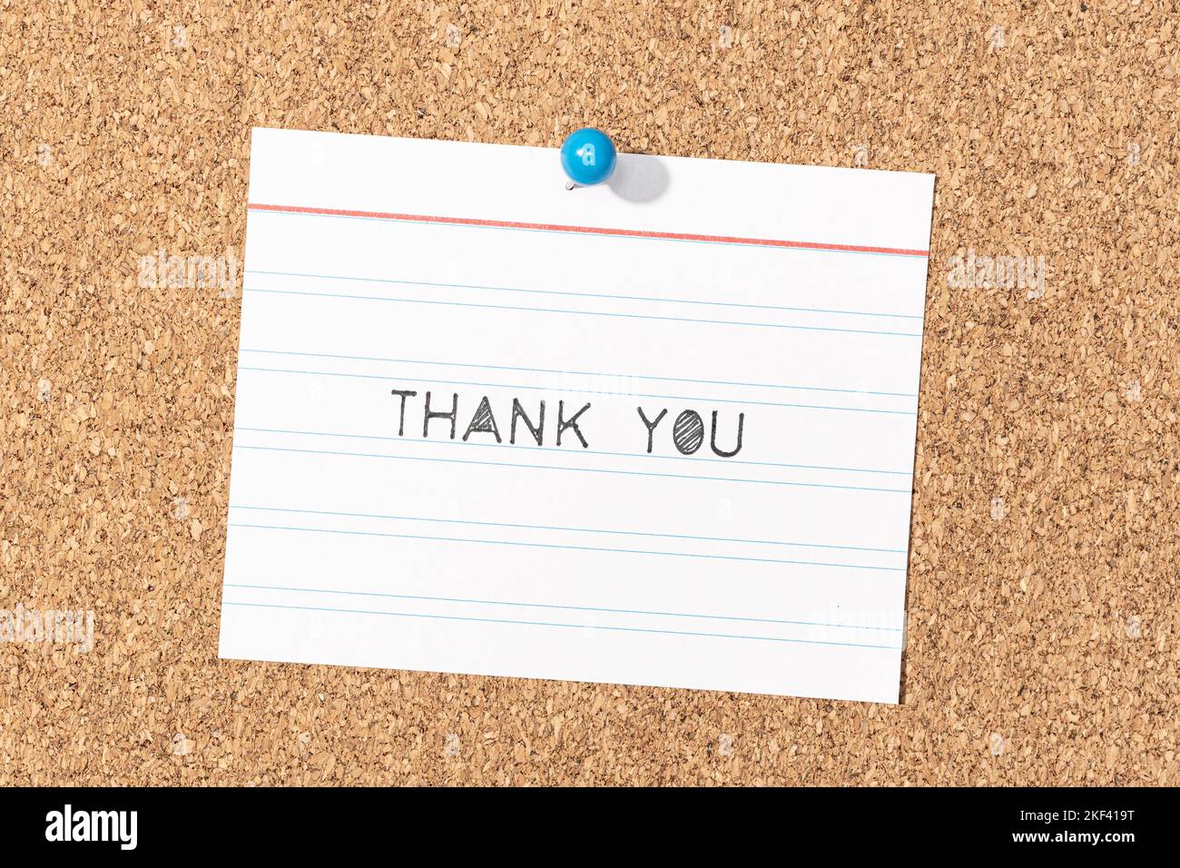 Thank you word phrase made white stencil letters on notepad pinned on ...