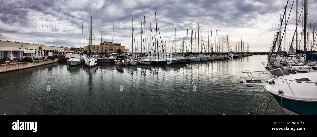Panoramic view at marina with many sail boats and pleasure boats moor ...