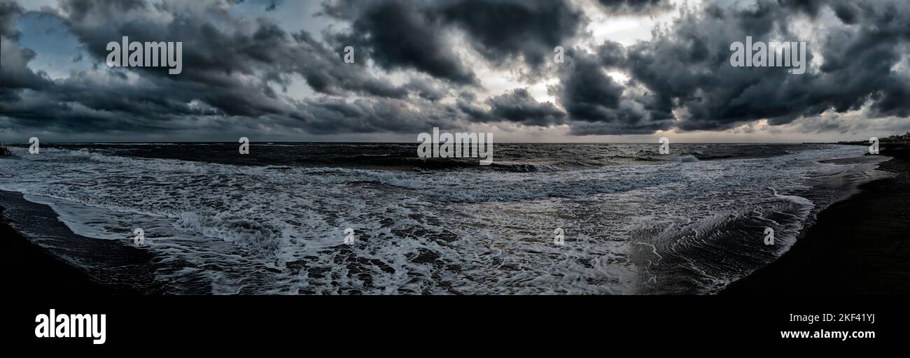 Scary weather sunset panoramic on the beach with dramatic sky with dark ...