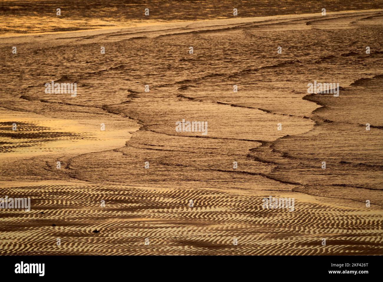 The sand trace from the waves on the seashore for backgrounds and ...