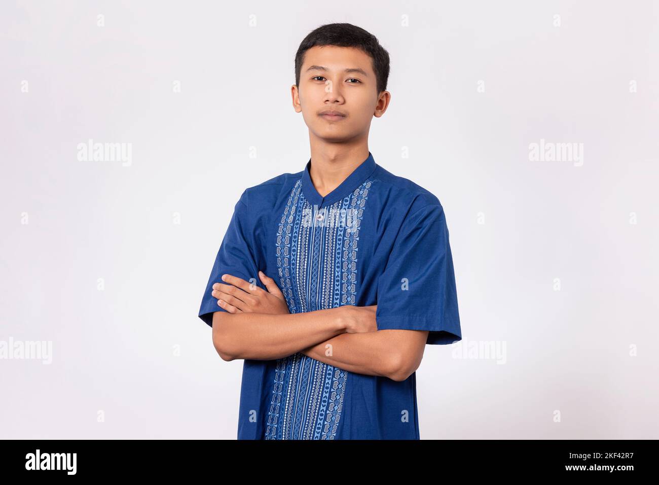 Smiling Asian muslim man happy celebrating Eid Al-Fitr isolated white ...