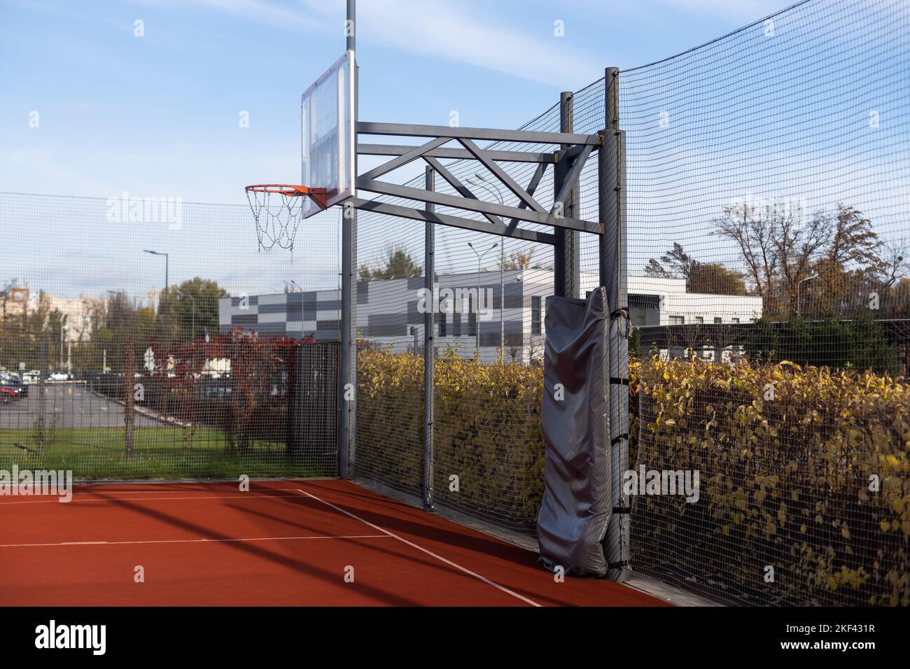 outdoor basketball in front of a blue sky. The basketball hoop or ring ...