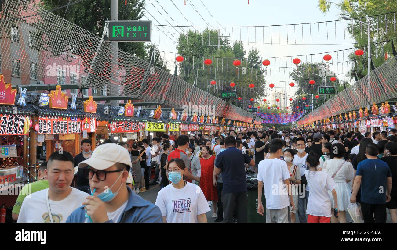 The crowds at the night market near the Harbin Normal University in ...