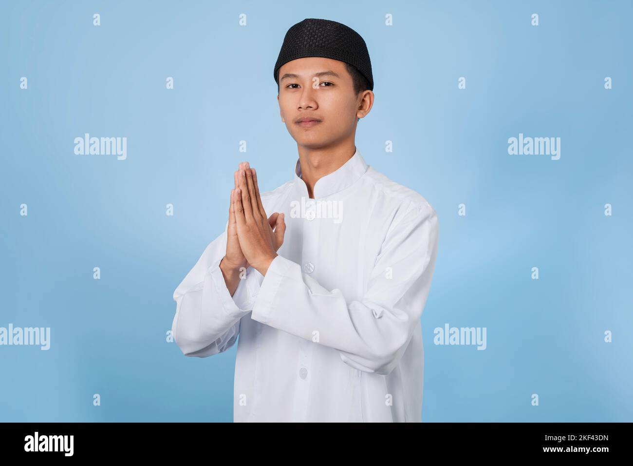 Smiling Asian muslim man happy celebrating Eid Al-Fitr isolated white ...