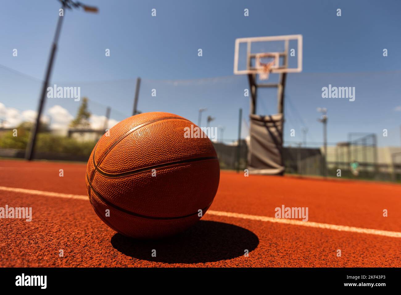 Top view orange ball for basketball lying on the rubber sport court ...
