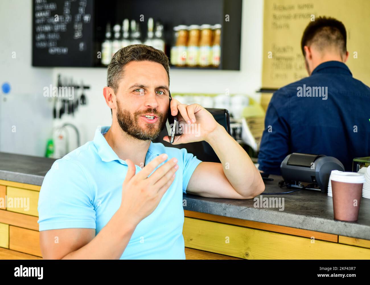 Lets meet in cafe. Man mobile conversation cafe barista background ...