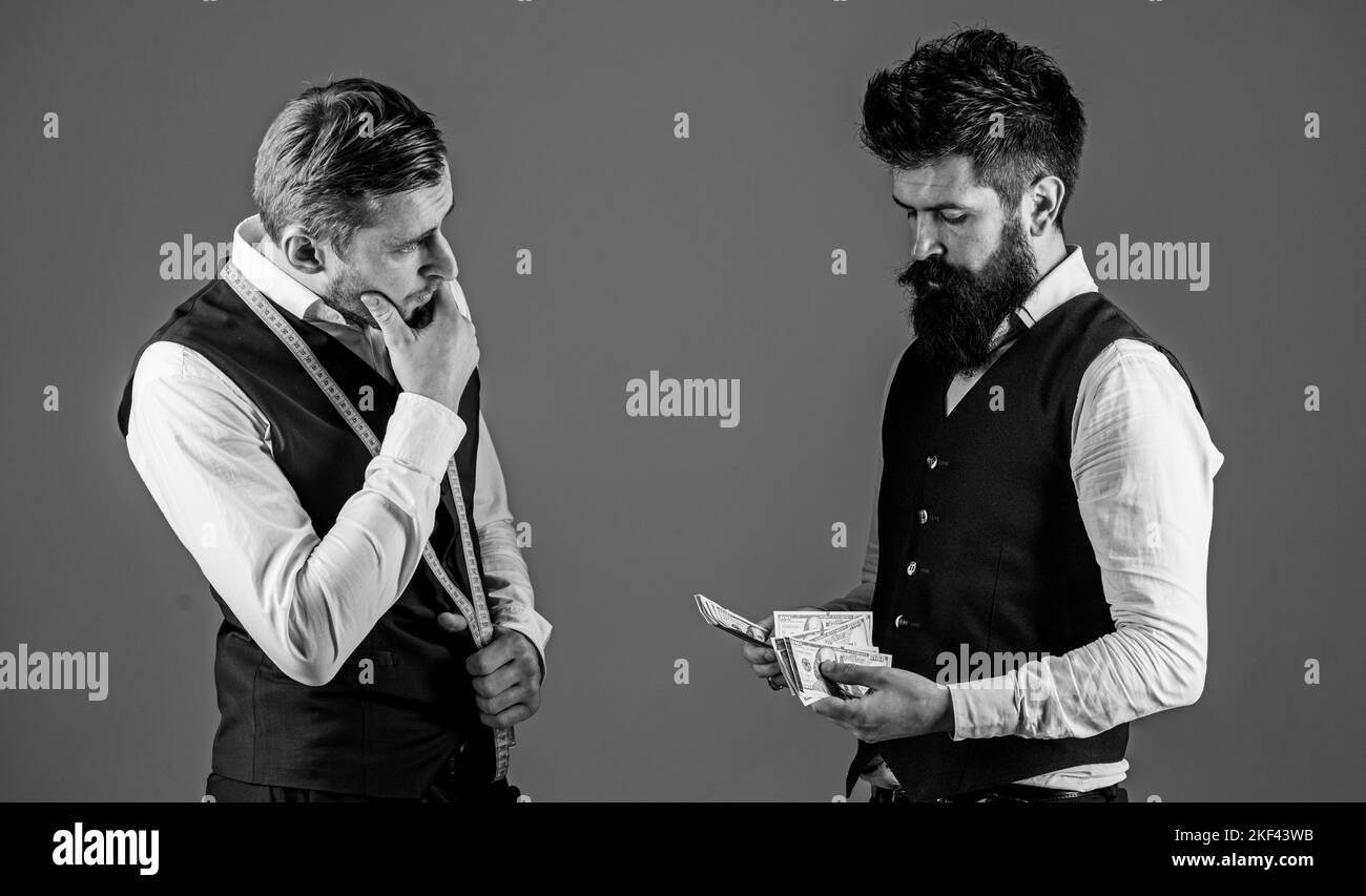 Customer, client paying, counting money, grey background Stock Photo ...