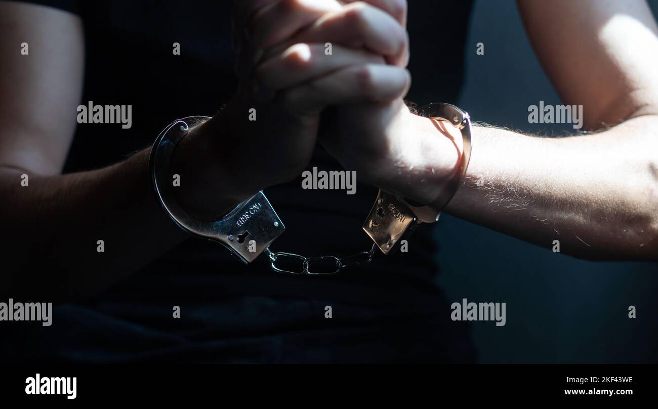 Woman hands in handcuffs behind back hi-res stock photography and ...
