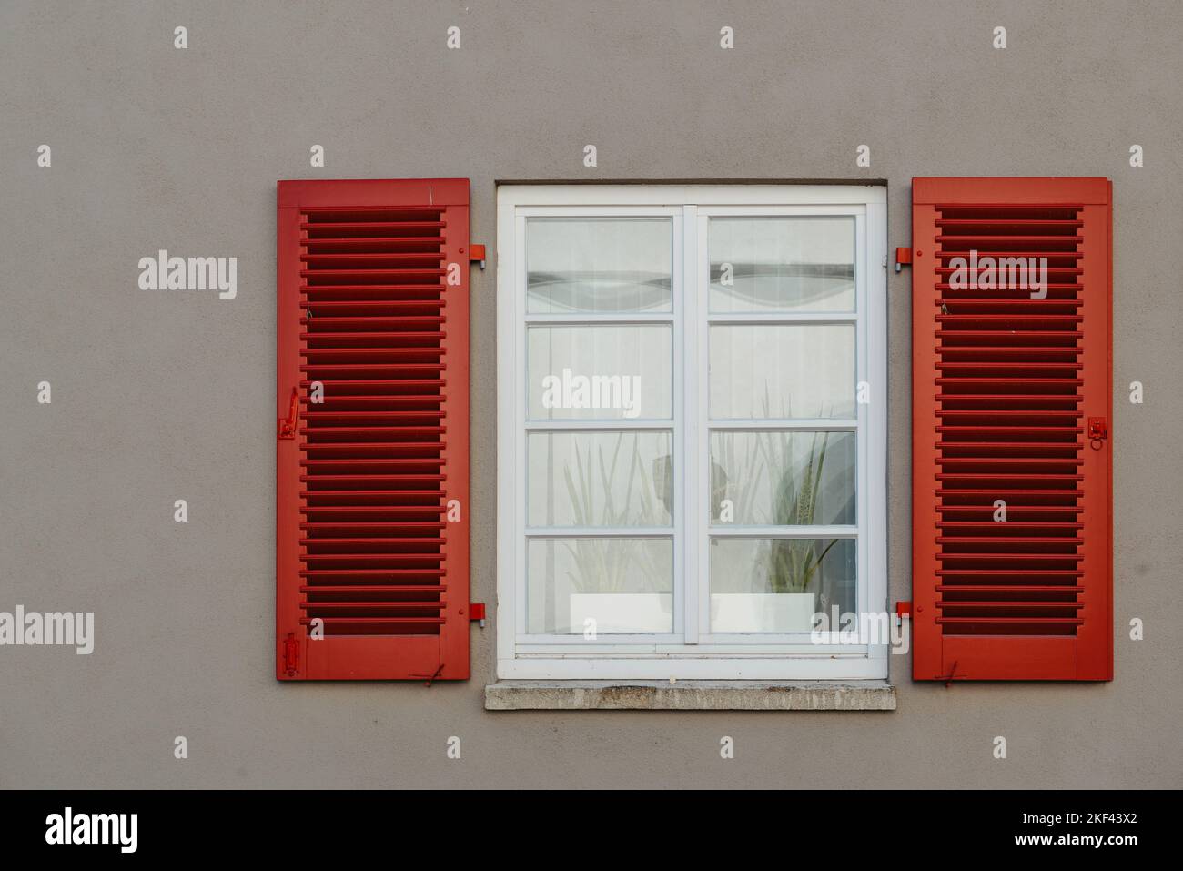Italian windows on the grey wall facade with open red color classic ...