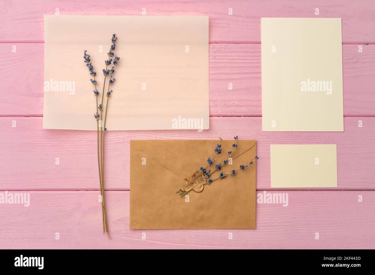 Envelope with letter on pink wooden background top view Stock Photo - Alamy