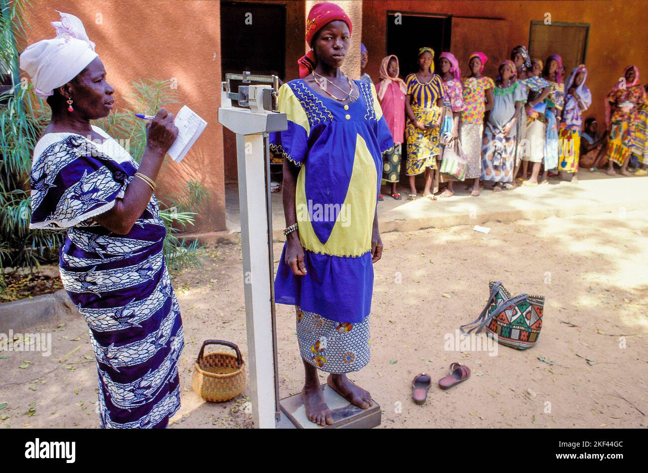 Burkina Faso, Piela. A pregnant woman is being weighed at a Tin Tua ...