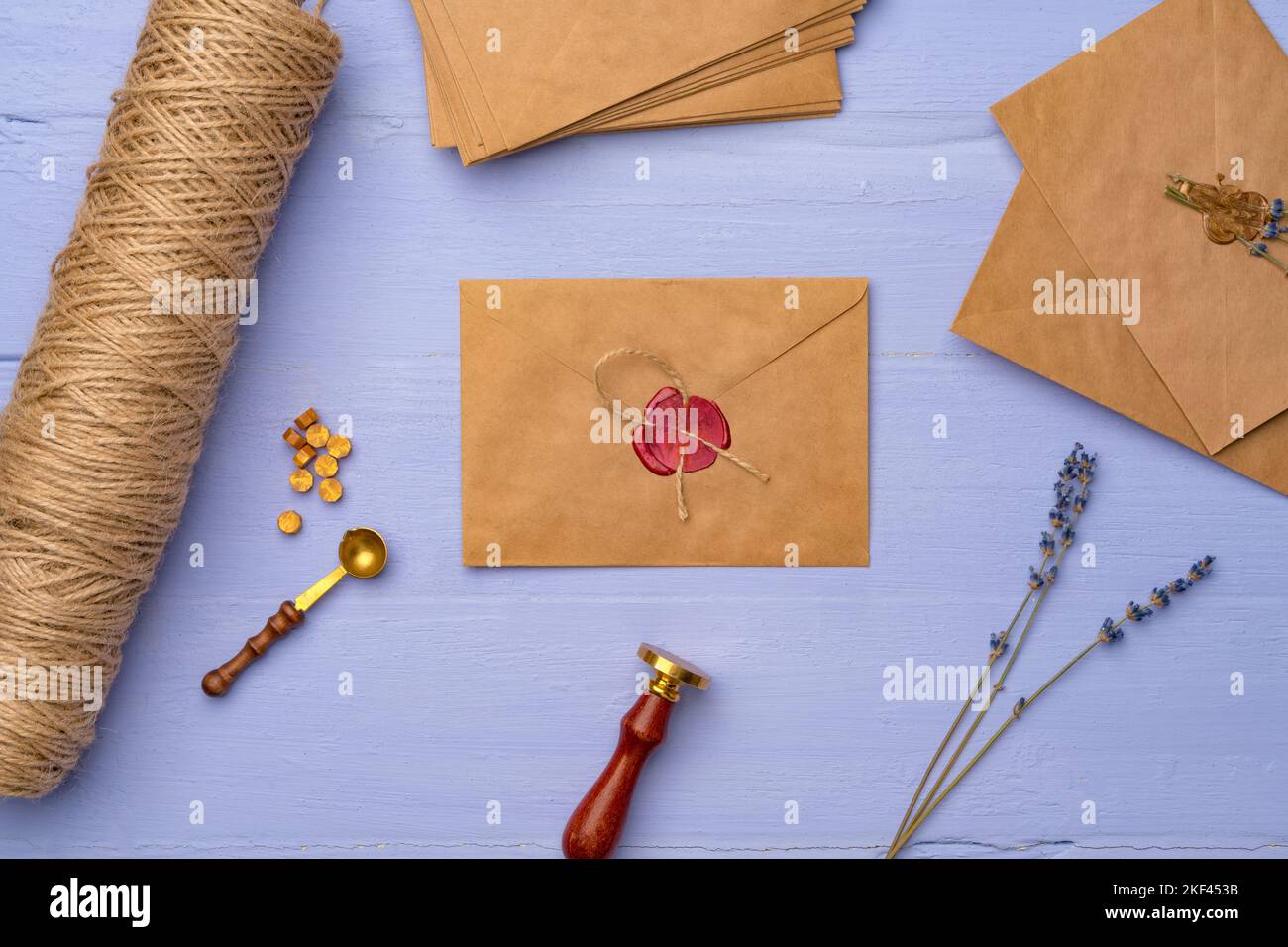 Handmade paper envelope on lavender wooden table Stock Photo - Alamy