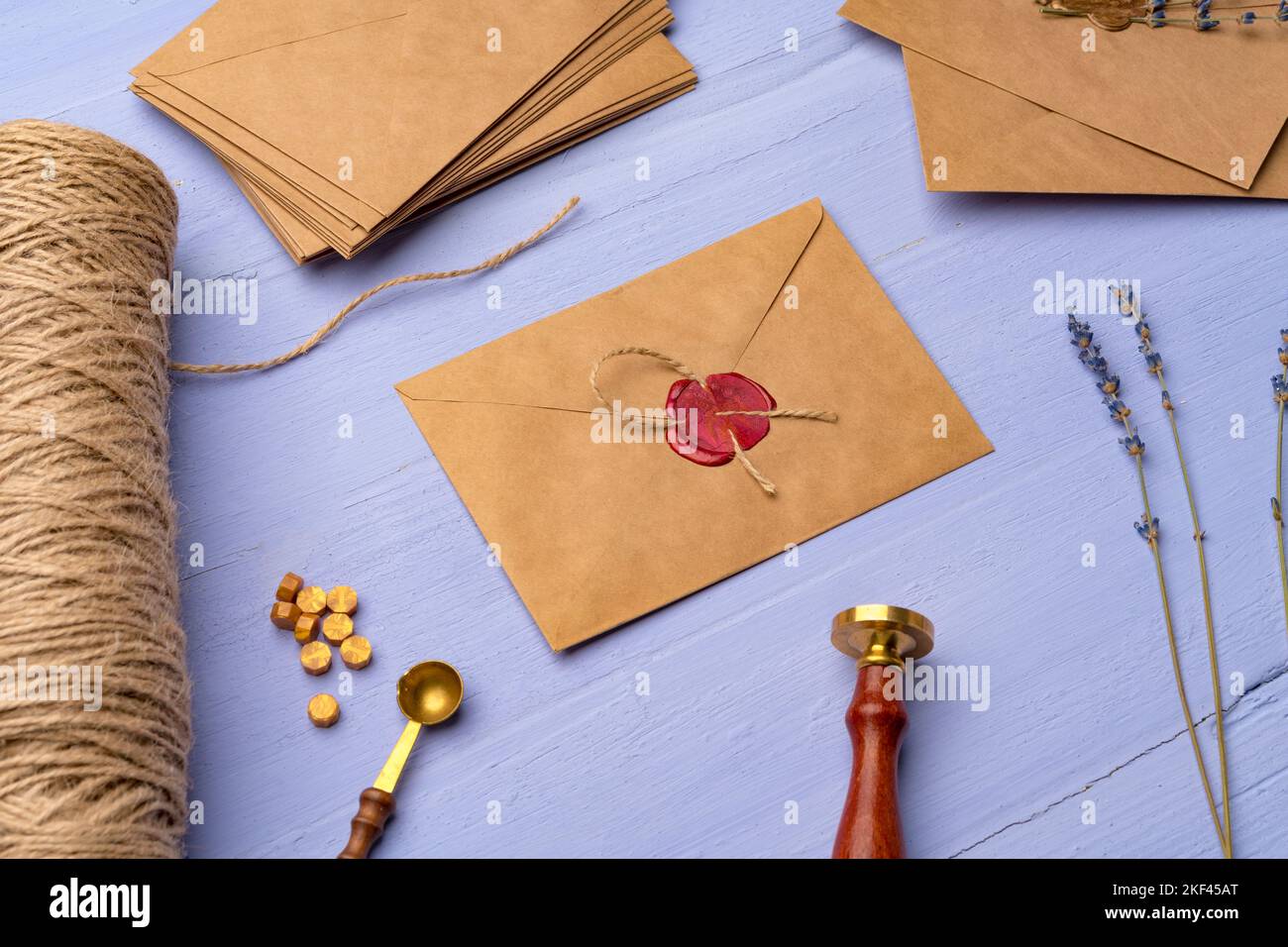 Handmade paper envelope on lavender wooden table Stock Photo - Alamy