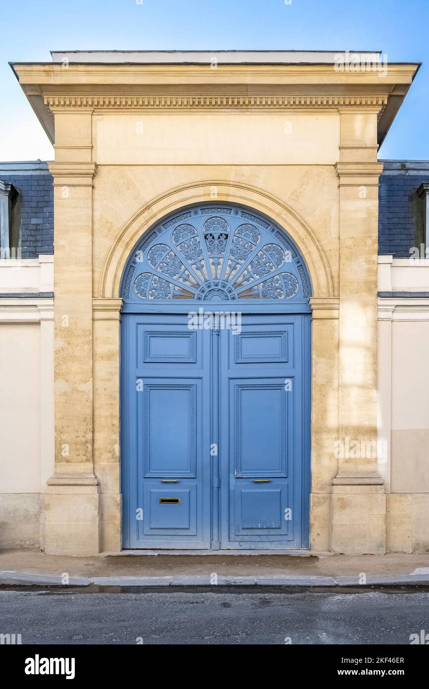 Paris, an ancient blue door, beautiful facade in a luxury neighborhood ...