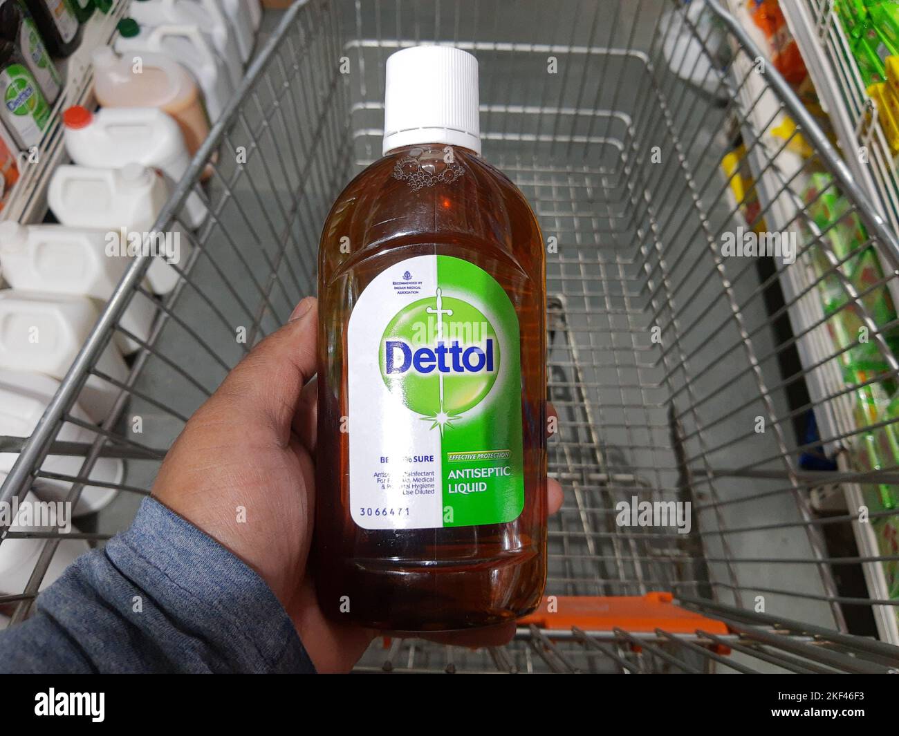 Close up hands holding a big bottle of Dettol hand sanitizer Stock ...