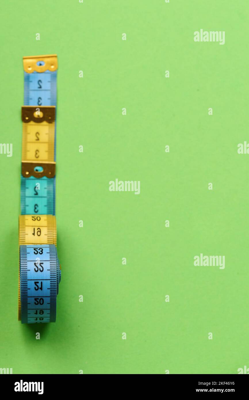 Creative measurements idea. Tape measures of cyan, blue, yellow colors ...