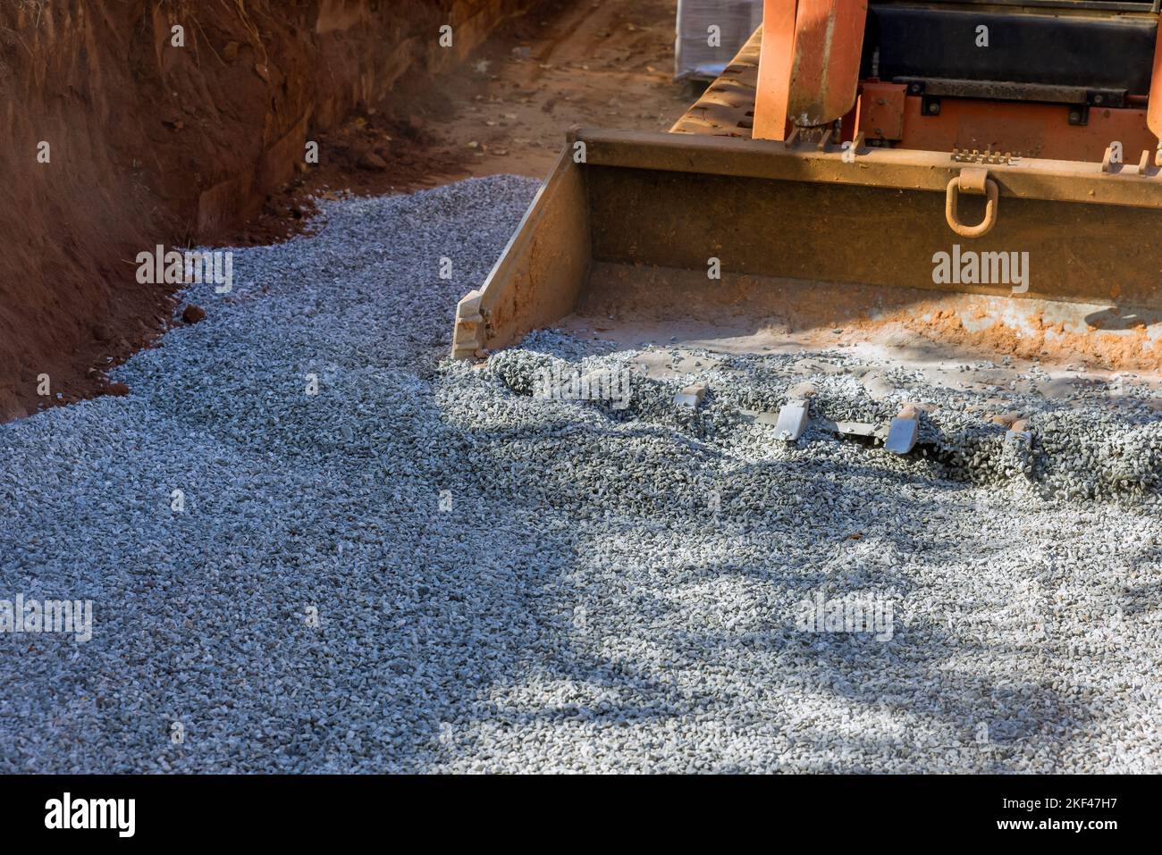 Road repair works on construction site to unload crushed stone from ...